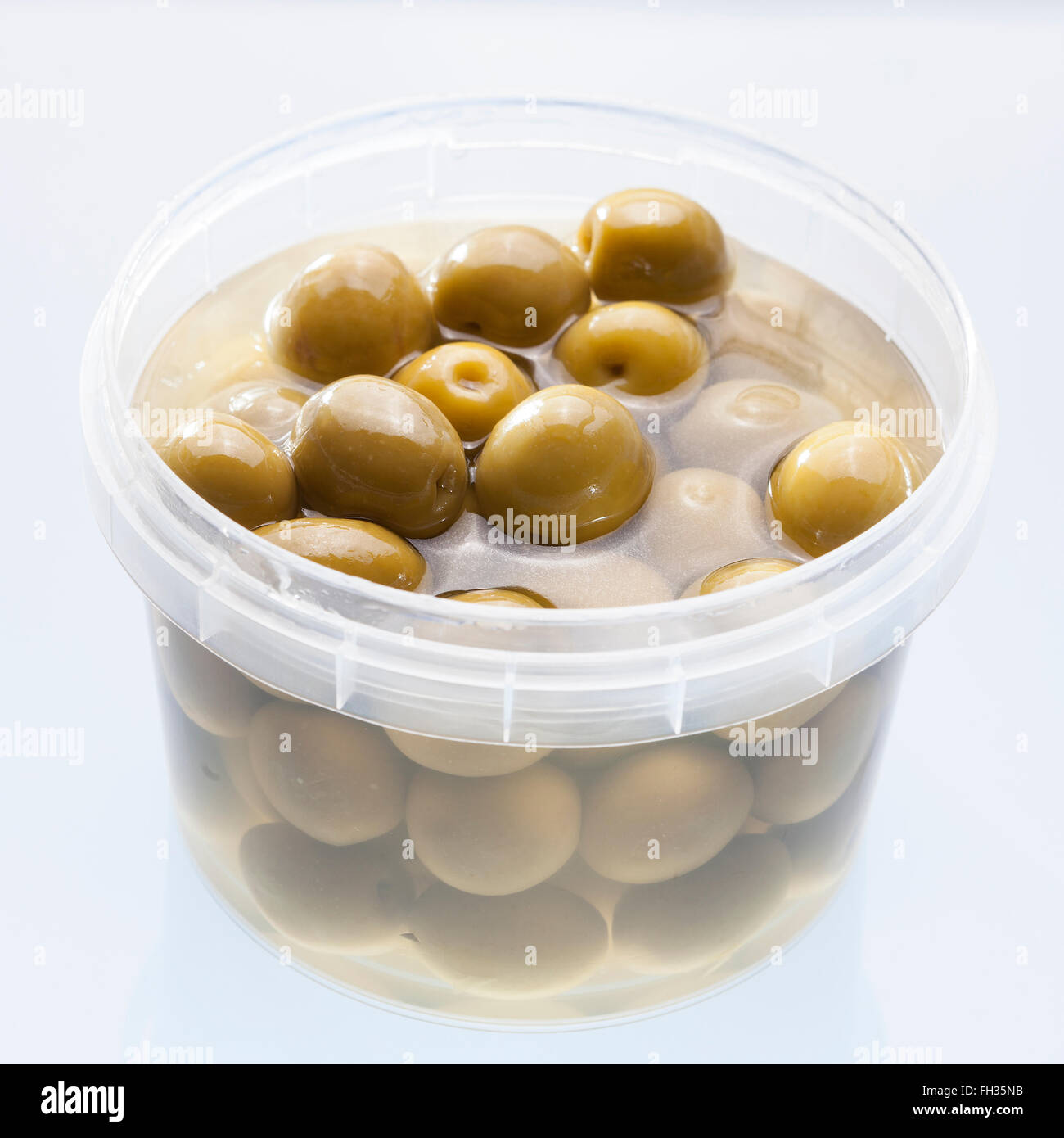 olives in a plastic pot Stock Photo - Alamy