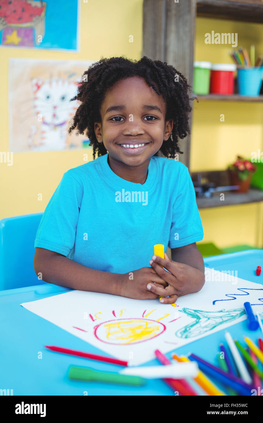 Happy kid drawing on his sheet Stock Photo - Alamy
