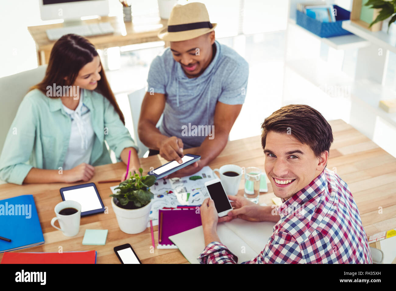 Young creative team working together Stock Photo - Alamy