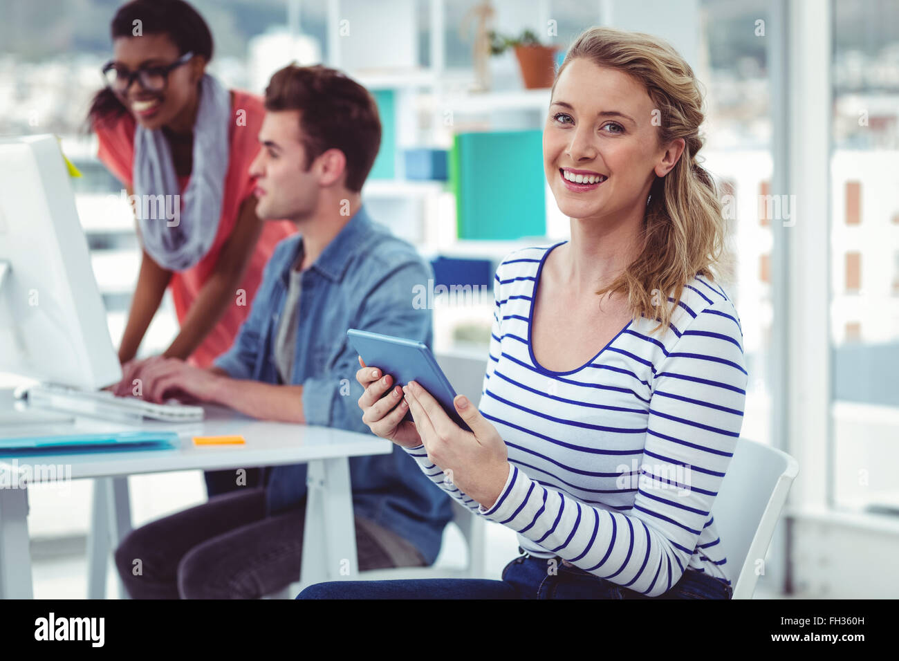 Creative business team working hard together Stock Photo - Alamy