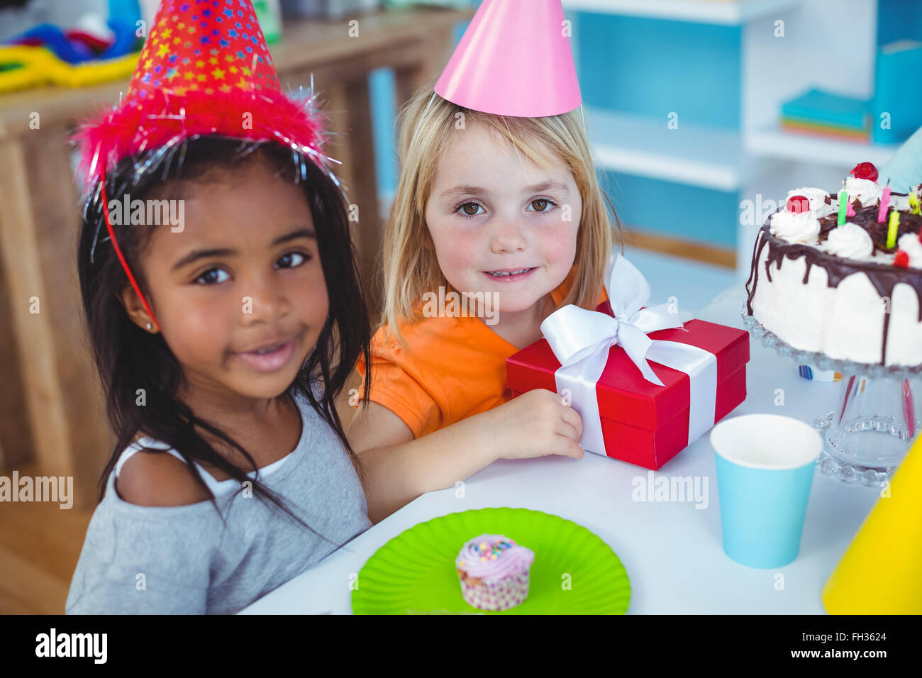 Excited kids enjoying a birthday party Stock Photo - Alamy