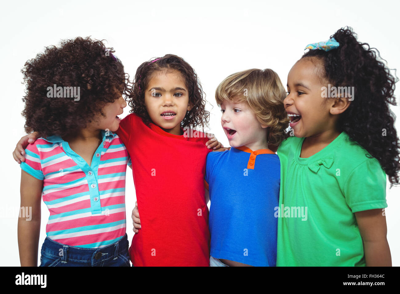Four kids standing together in a line Stock Photo - Alamy