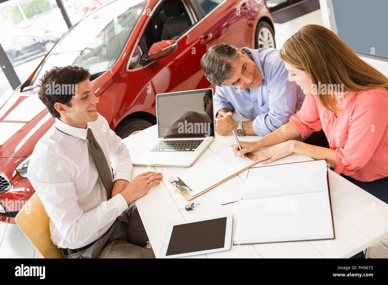 Customers signing some important documents Stock Photo - Alamy