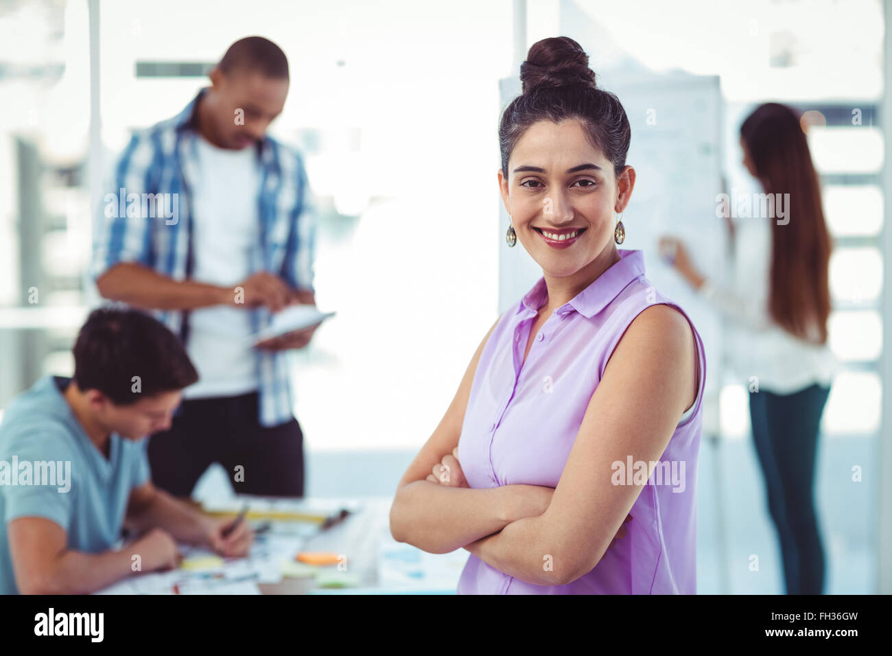 Young creative worker smiling at camera Stock Photo - Alamy