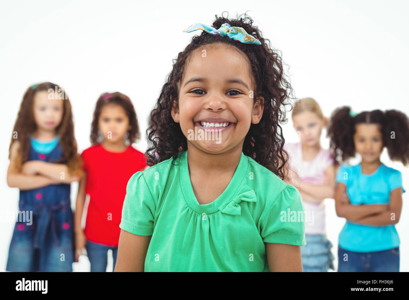 Kids standing together with girl in front Stock Photo - Alamy
