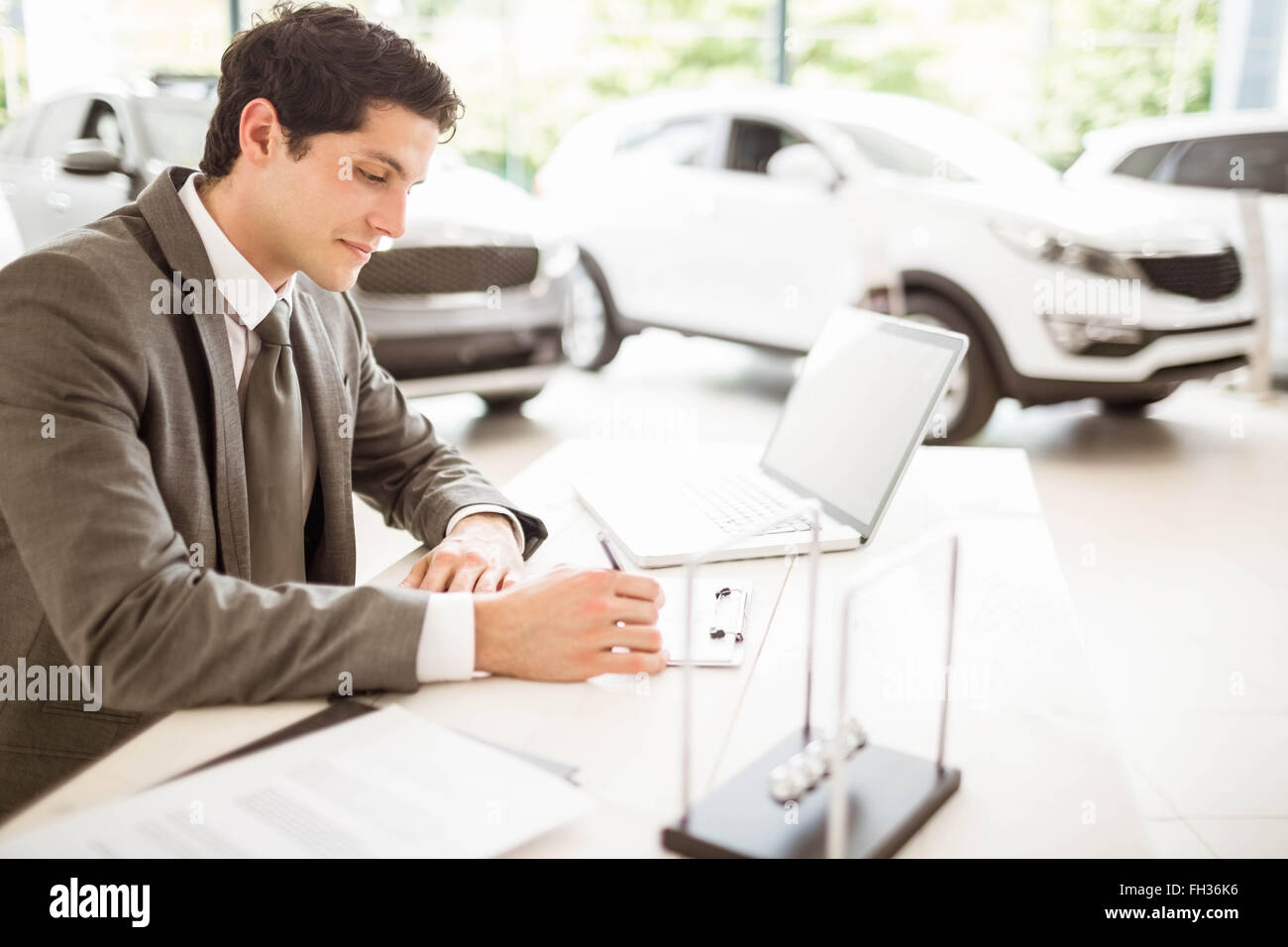 Car salesman sitting desk in hi-res stock photography and images - Alamy