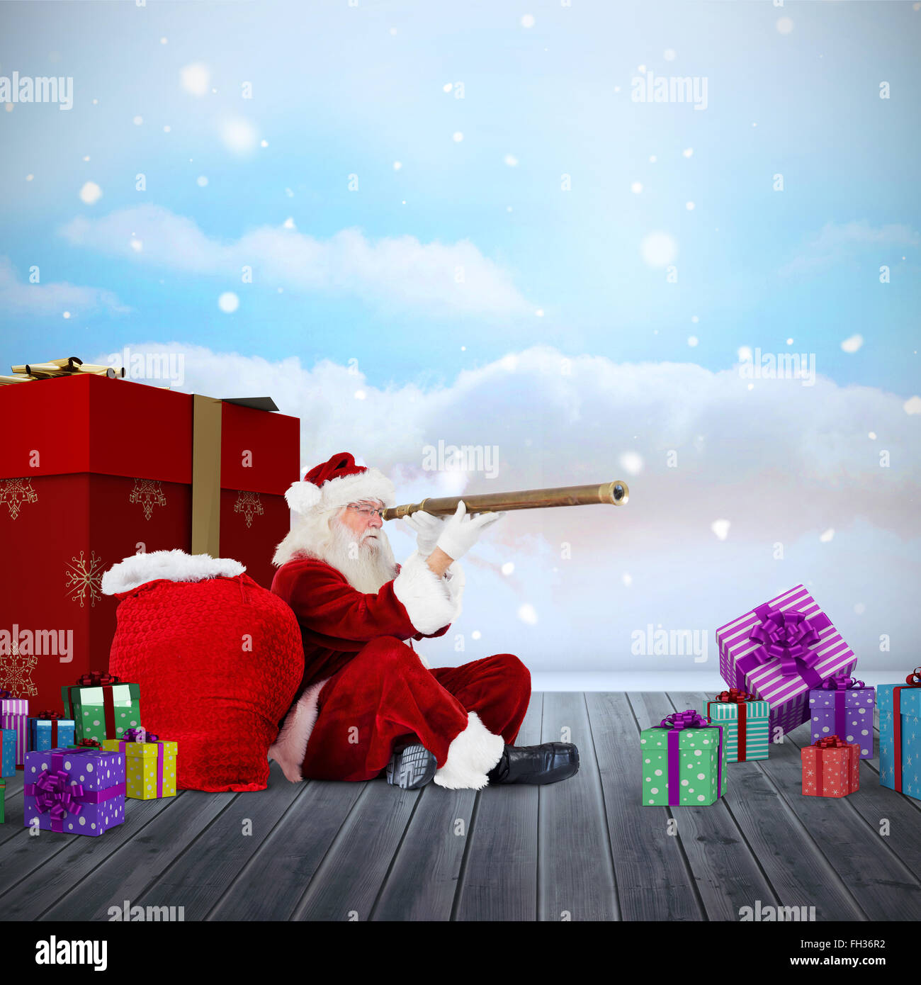 Composite image of santa looking through a telescope Stock Photo - Alamy
