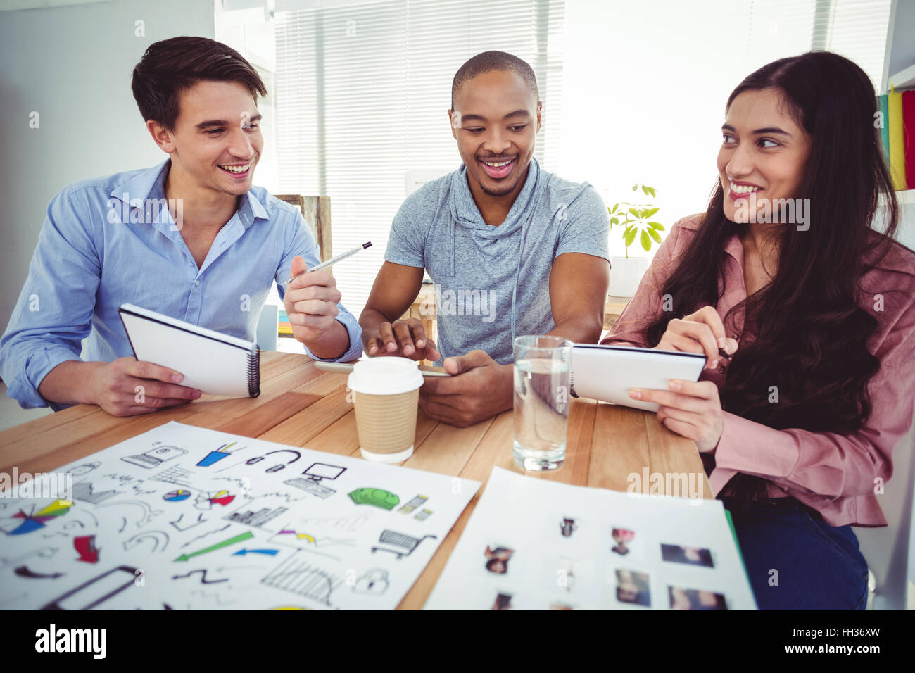 Young creative team having a meeting Stock Photo - Alamy