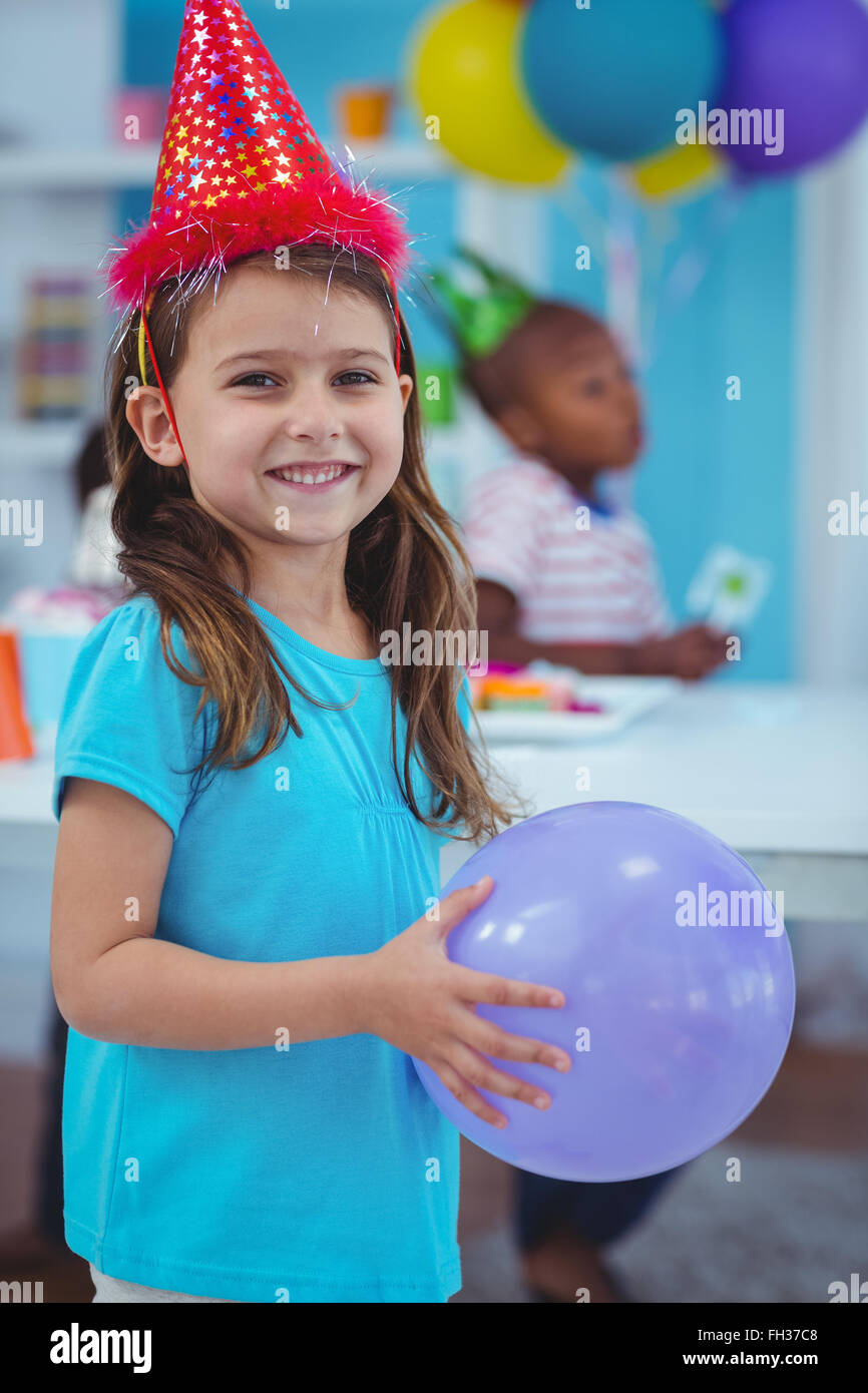 Happy kid holding a balloon Stock Photo - Alamy