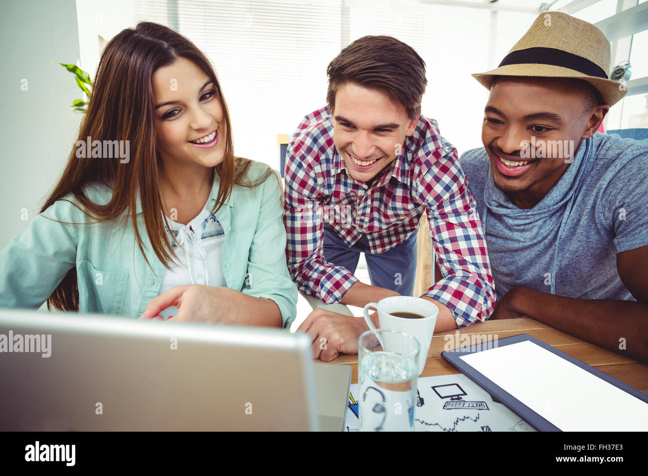 Young creative team working together Stock Photo - Alamy