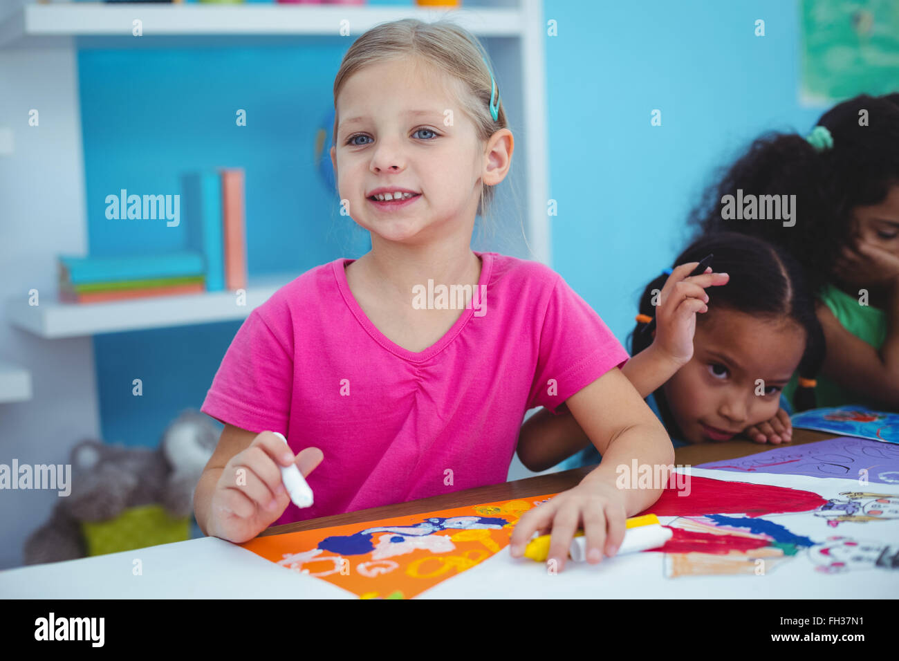 Happy kids all drawing pictures Stock Photo - Alamy