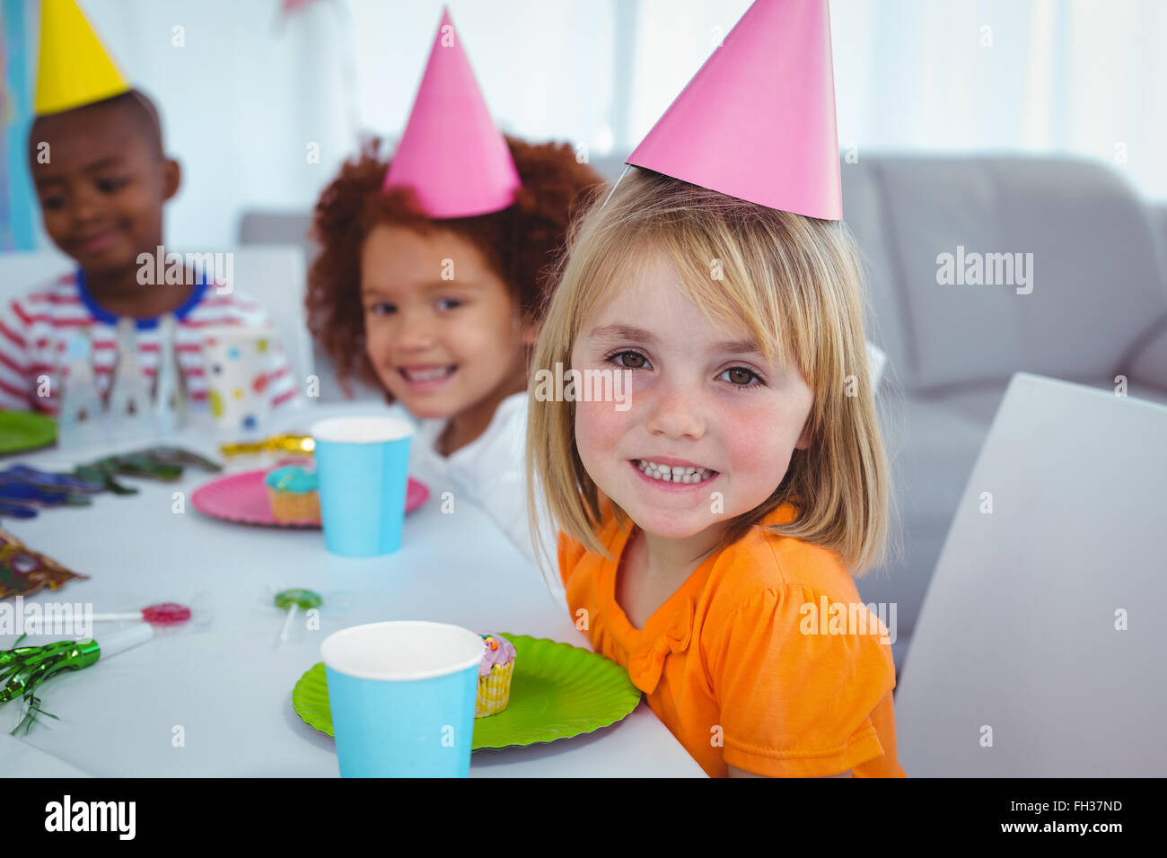Excited kids enjoying a birthday party Stock Photo - Alamy
