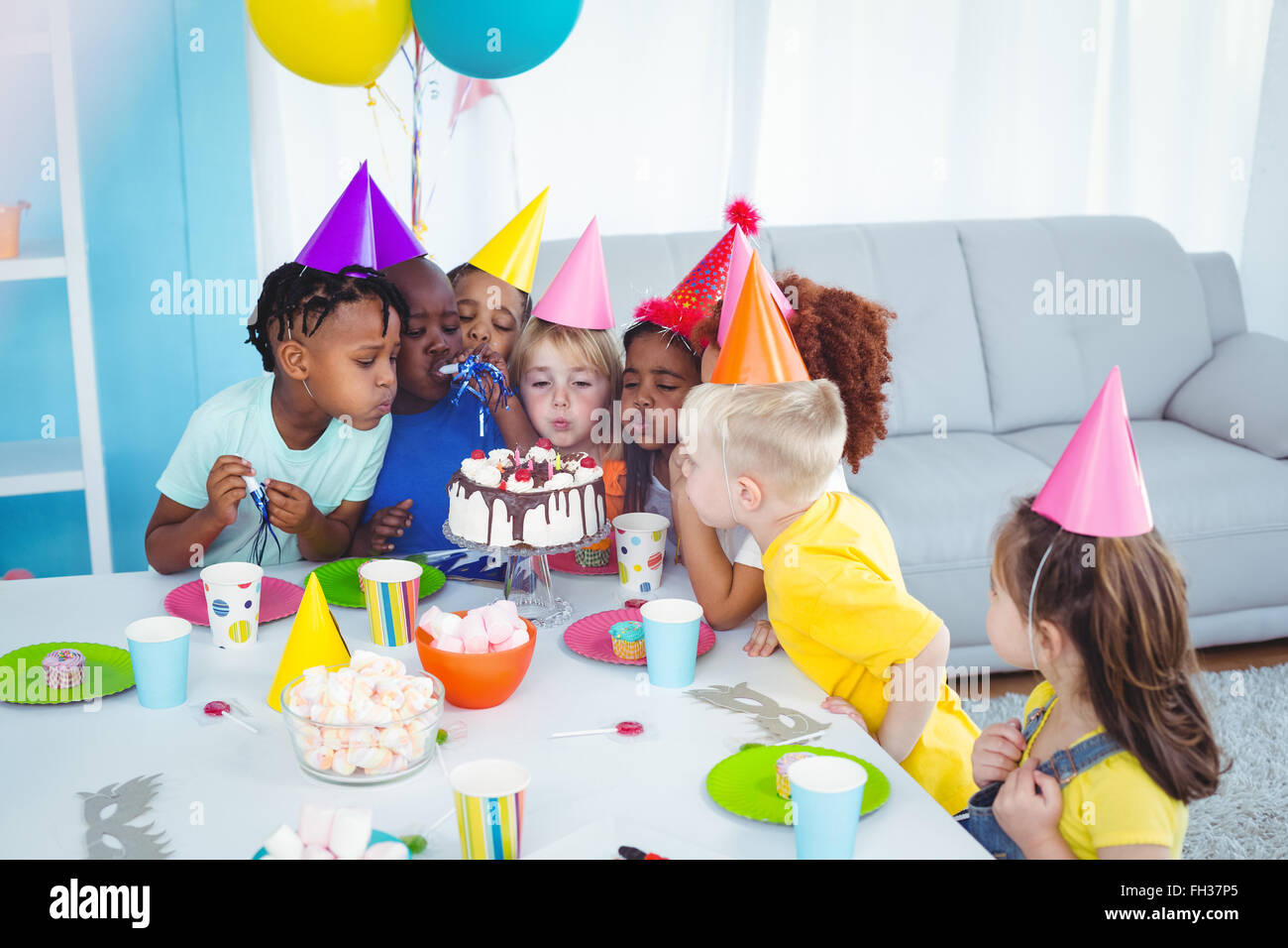 Excited kids enjoying a birthday party Stock Photo - Alamy