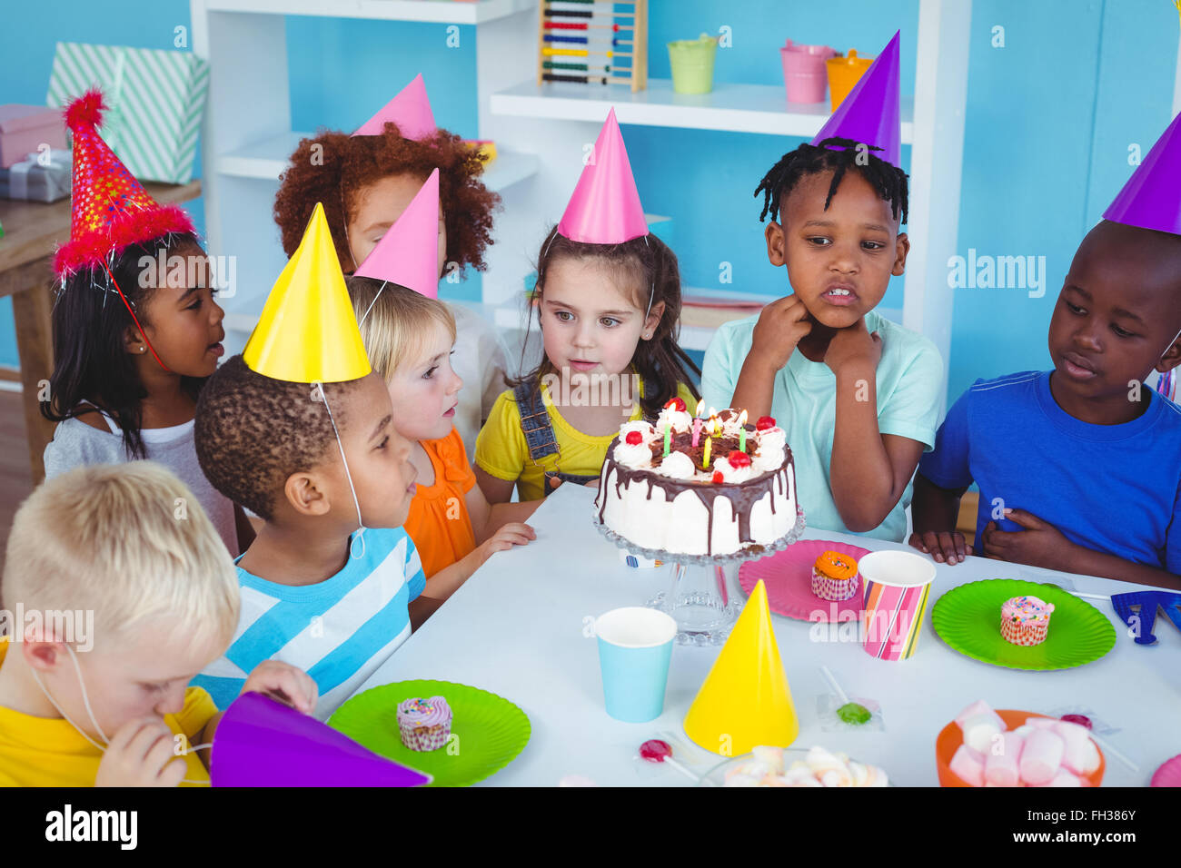 Excited kids enjoying a birthday party Stock Photo - Alamy