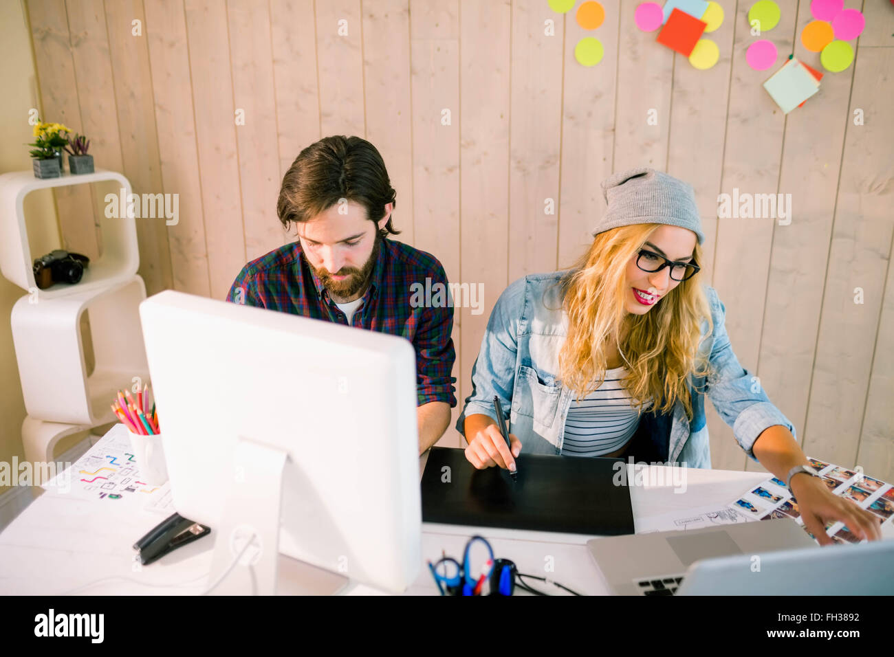 Creative team working at desk Stock Photo - Alamy