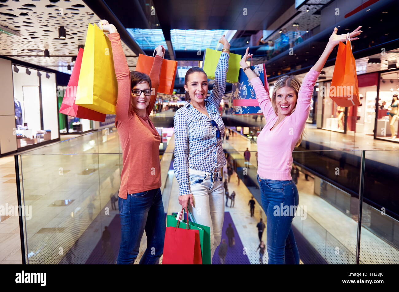 happy young girls in shopping mall Stock Photo - Alamy