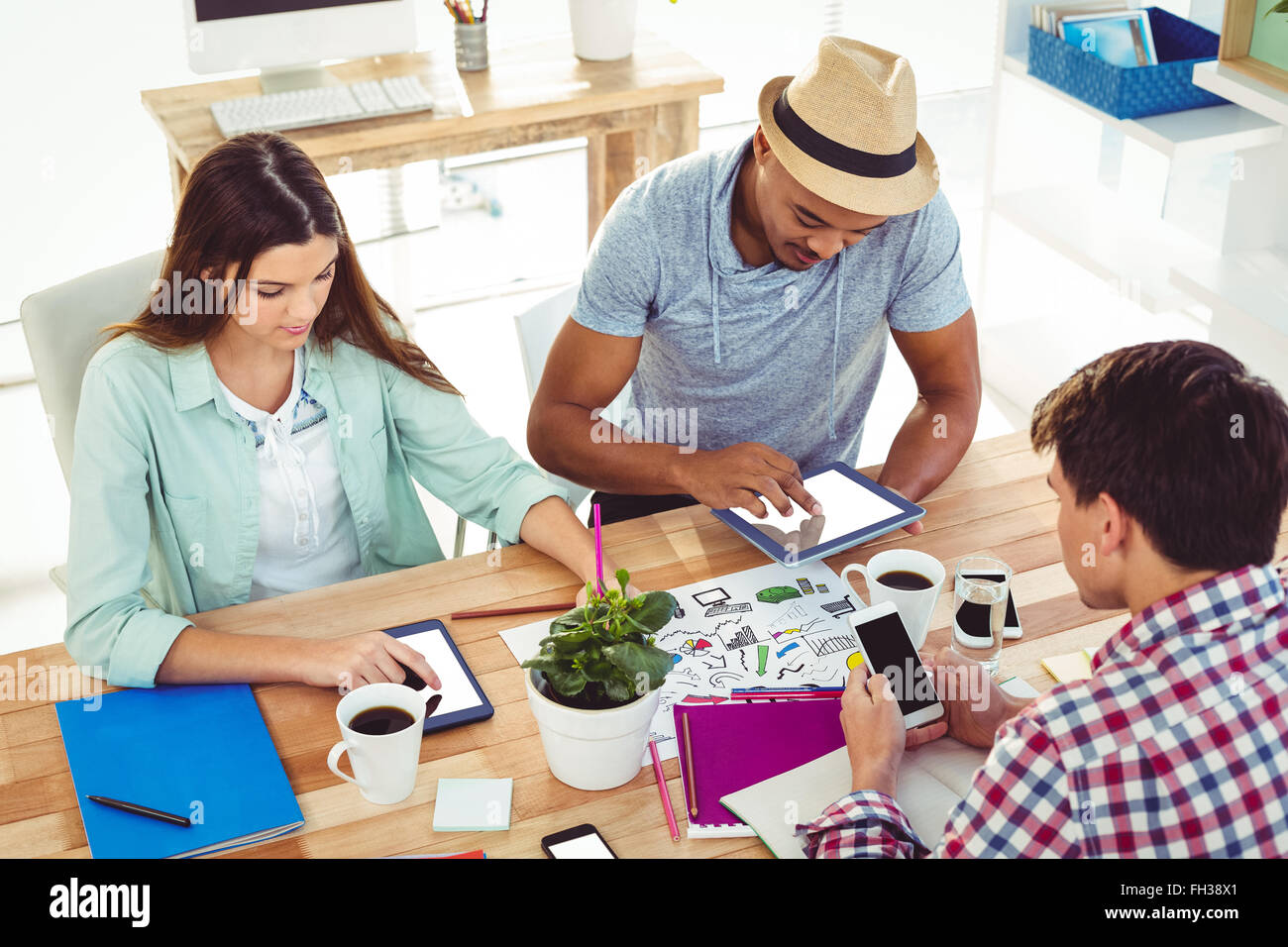 Young creative team working together Stock Photo - Alamy