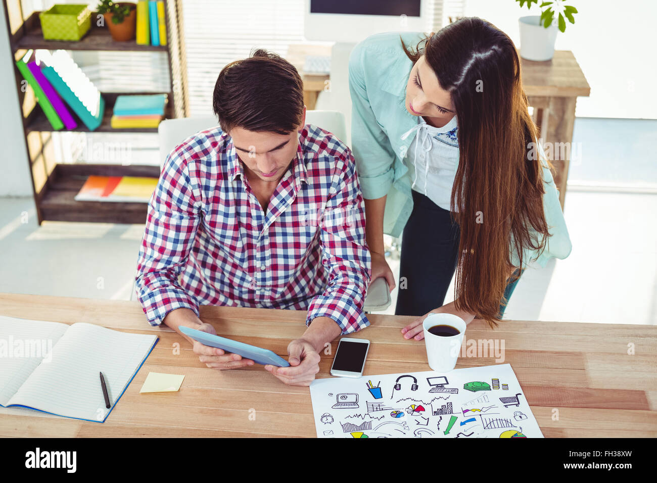 Creative team working together at desk Stock Photo - Alamy