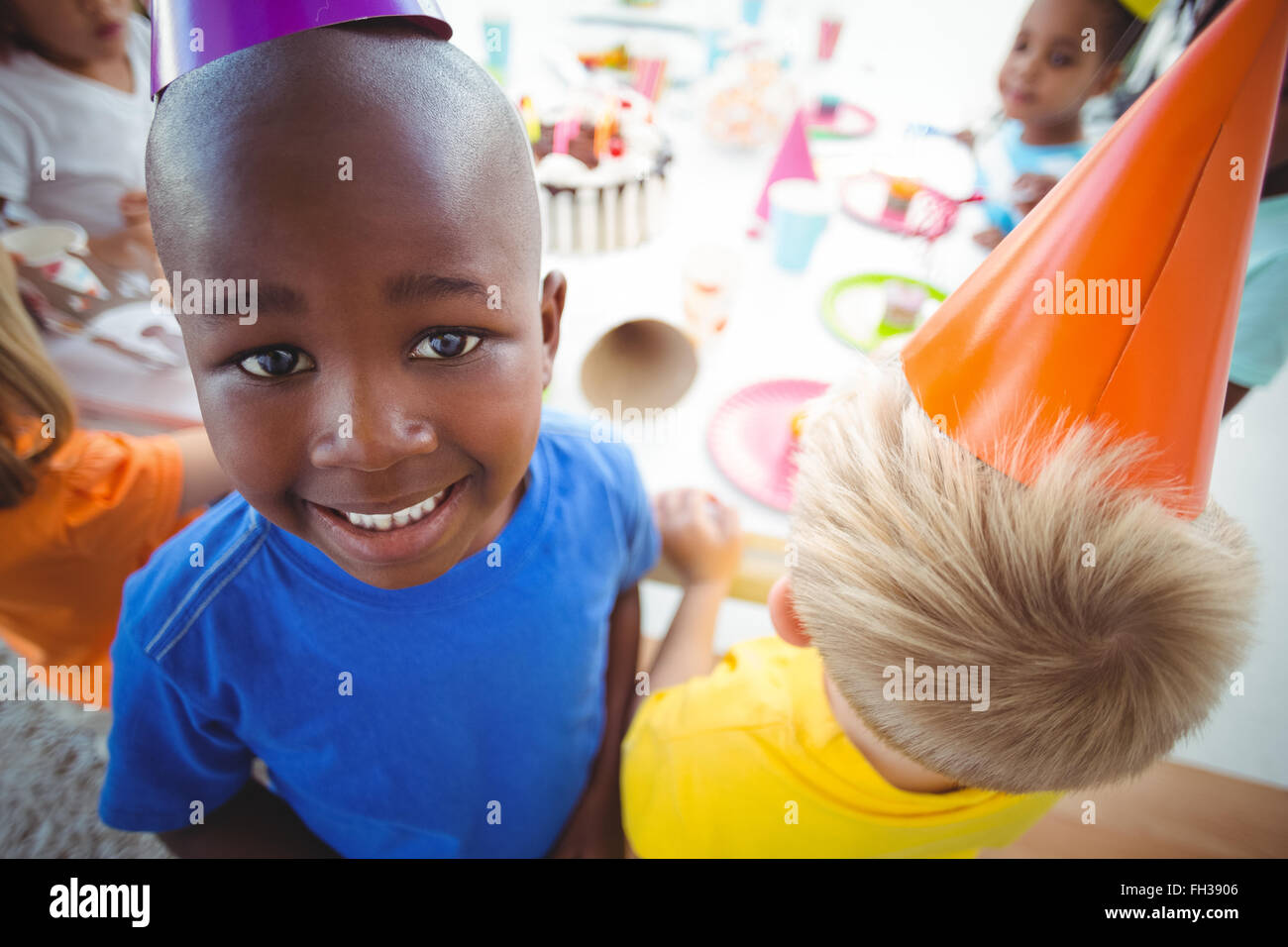Excited kids enjoying a birthday party Stock Photo - Alamy