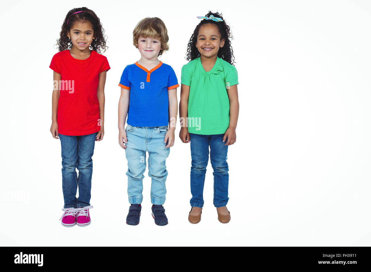 Three small kids standing in a line Stock Photo - Alamy
