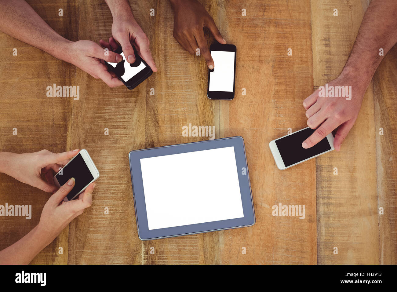 Creative team working together on a tablet and smartphones Stock Photo ...