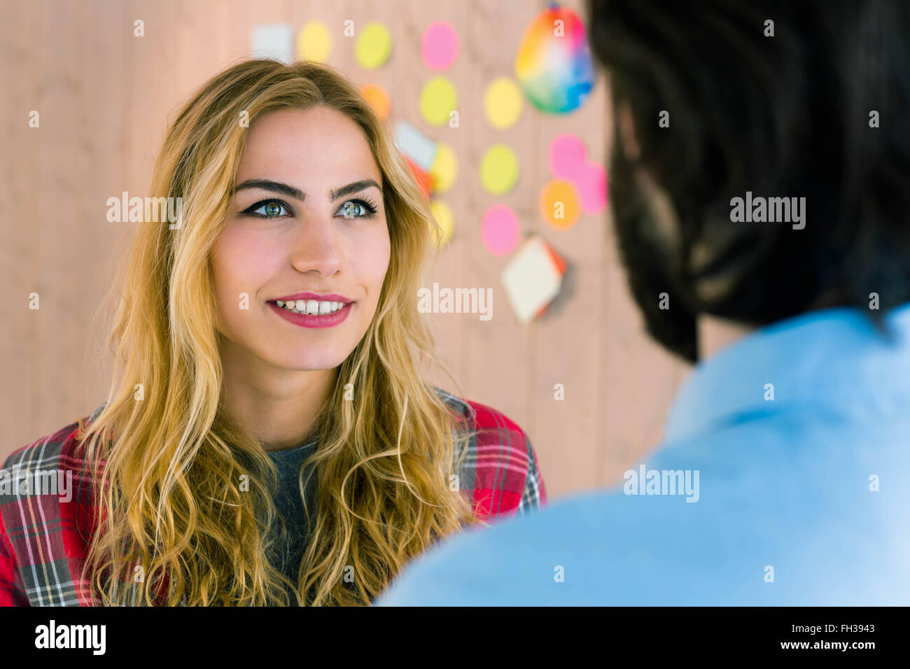 Creative team talking and smiling Stock Photo - Alamy