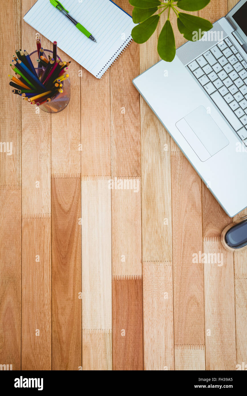 Business desk with laptop and colors pencil Stock Photo - Alamy