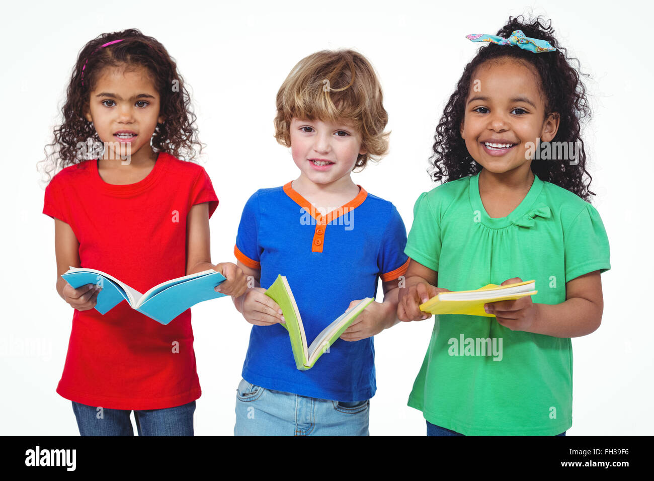 Three kids standing with books in their hands Stock Photo - Alamy