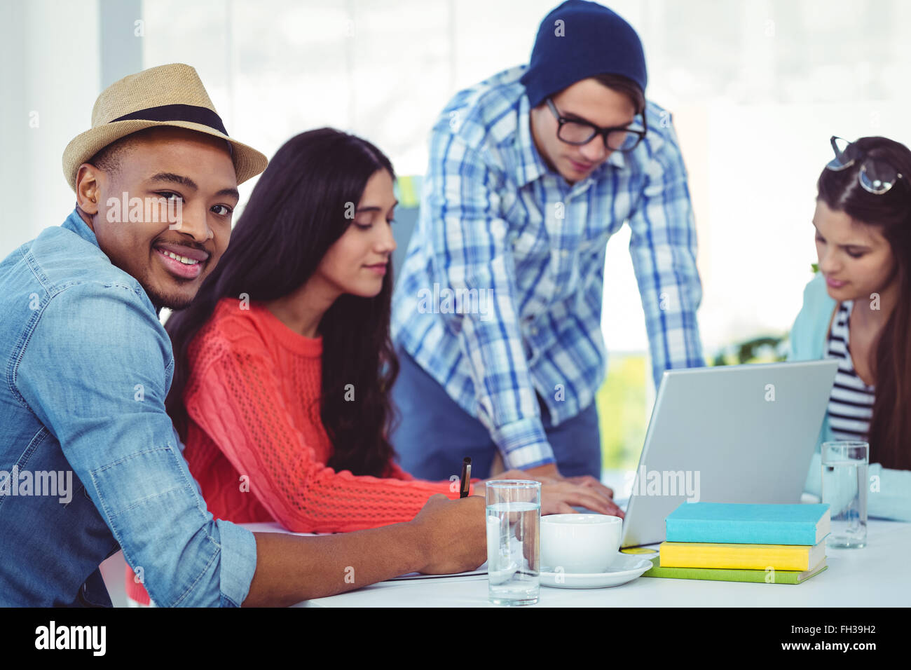 Young creative team having a meeting Stock Photo - Alamy