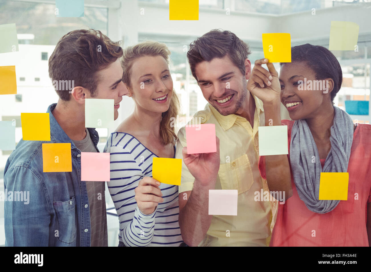 Creative team using post it notes Stock Photo - Alamy