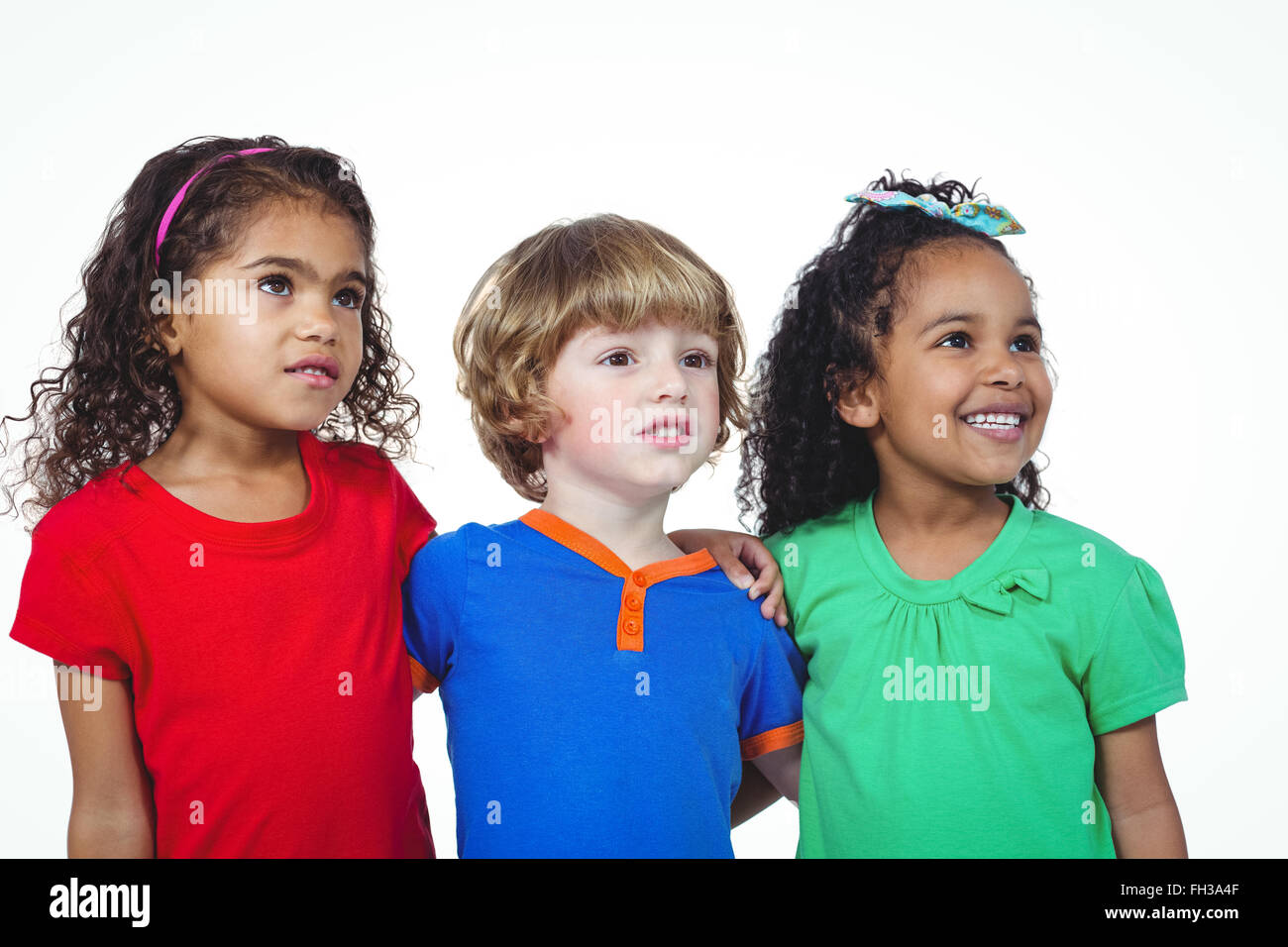 Three small kids standing in a line Stock Photo - Alamy