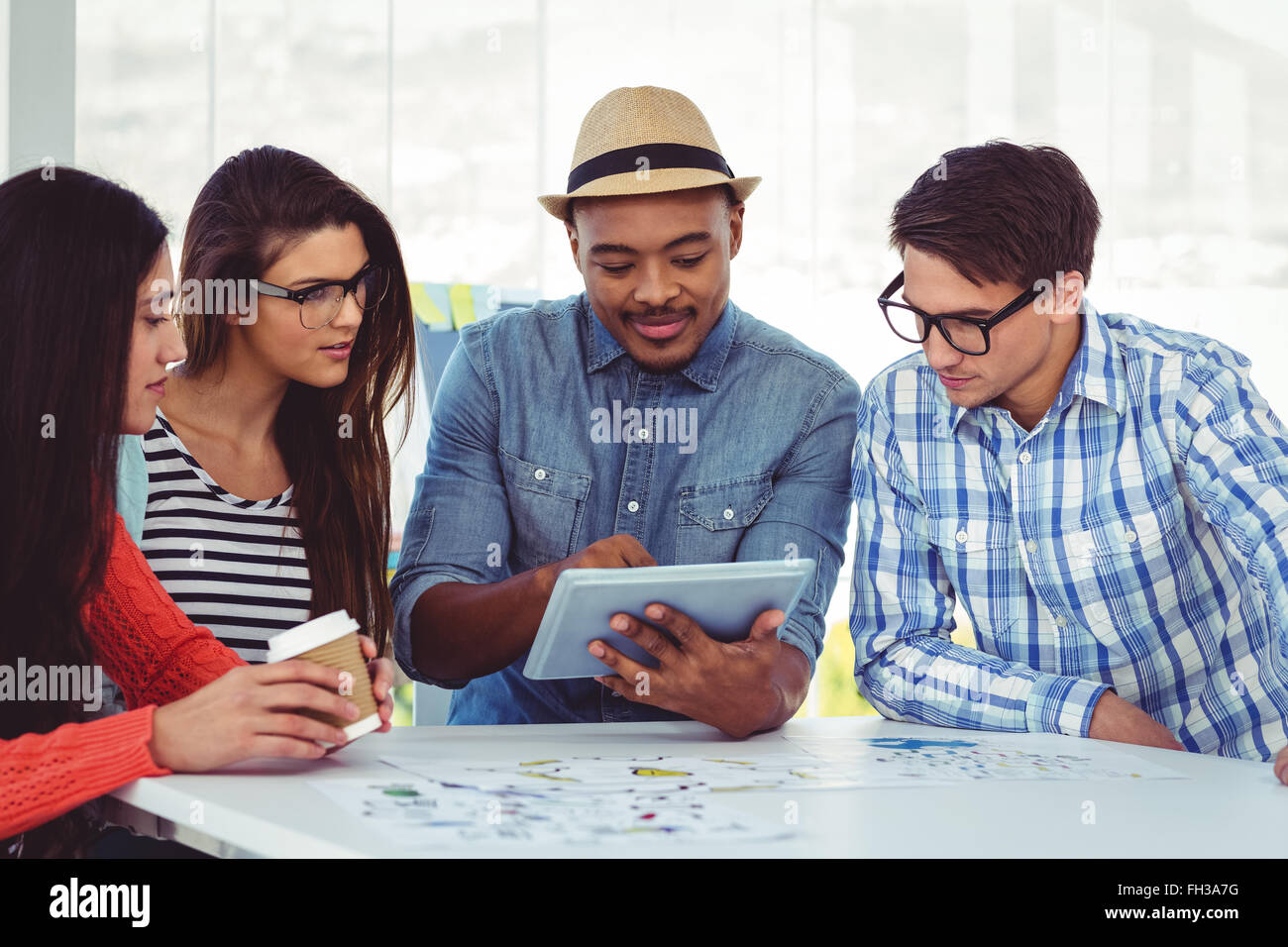 Young creative team having a meeting Stock Photo - Alamy