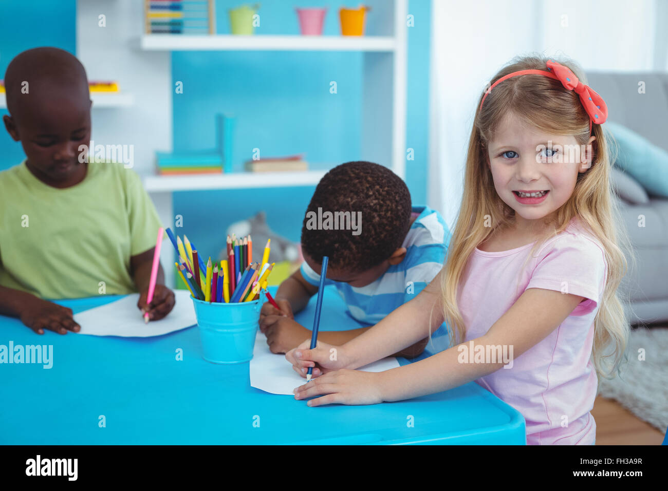Happy kids enjoying arts and crafts together Stock Photo - Alamy
