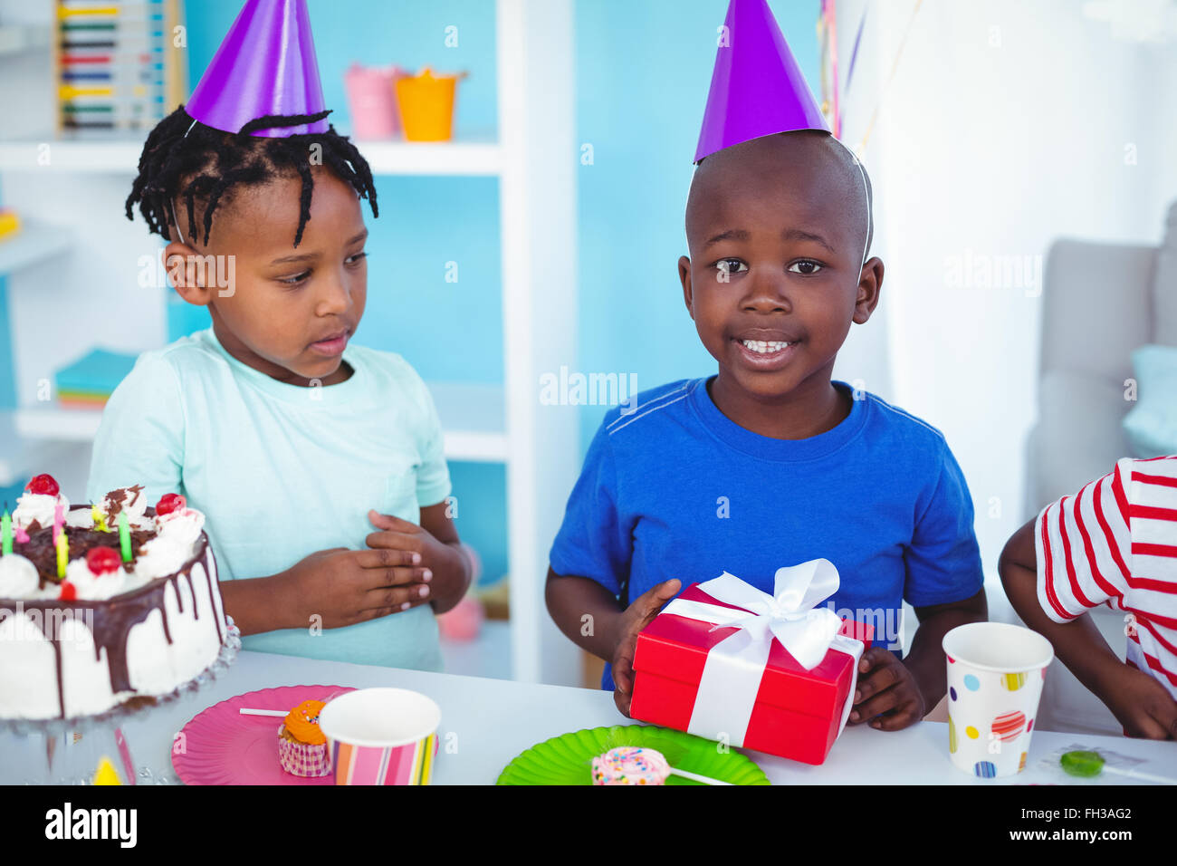 Excited kids enjoying a birthday party Stock Photo - Alamy
