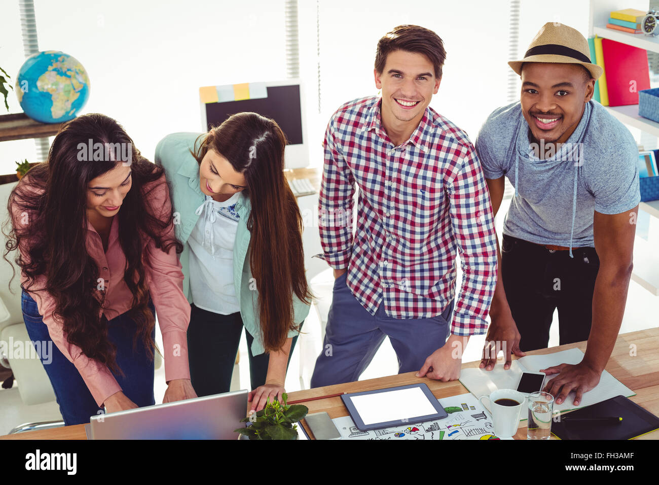 Young creative team working together Stock Photo - Alamy