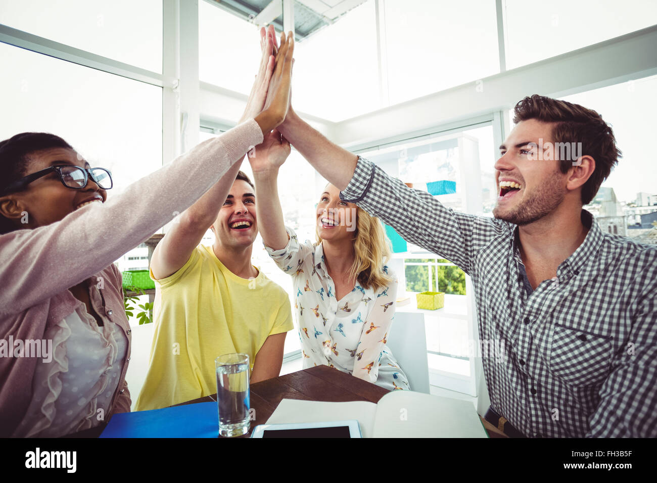 Creative business team working hard together Stock Photo - Alamy