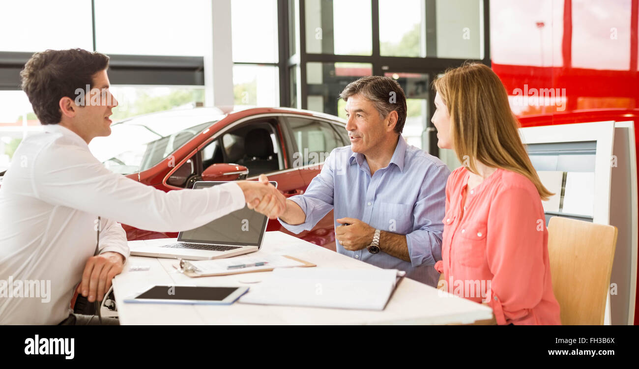Customers signing some important documents Stock Photo - Alamy