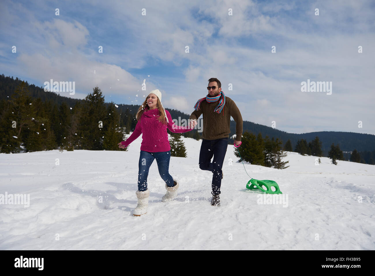 happy young couple having fun on fresh show on winter vacation Stock ...