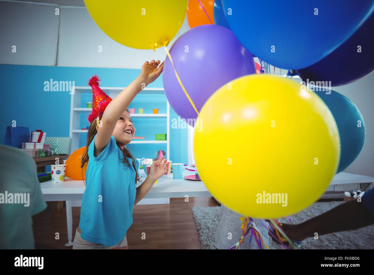 Happy kids with balloons Stock Photo - Alamy