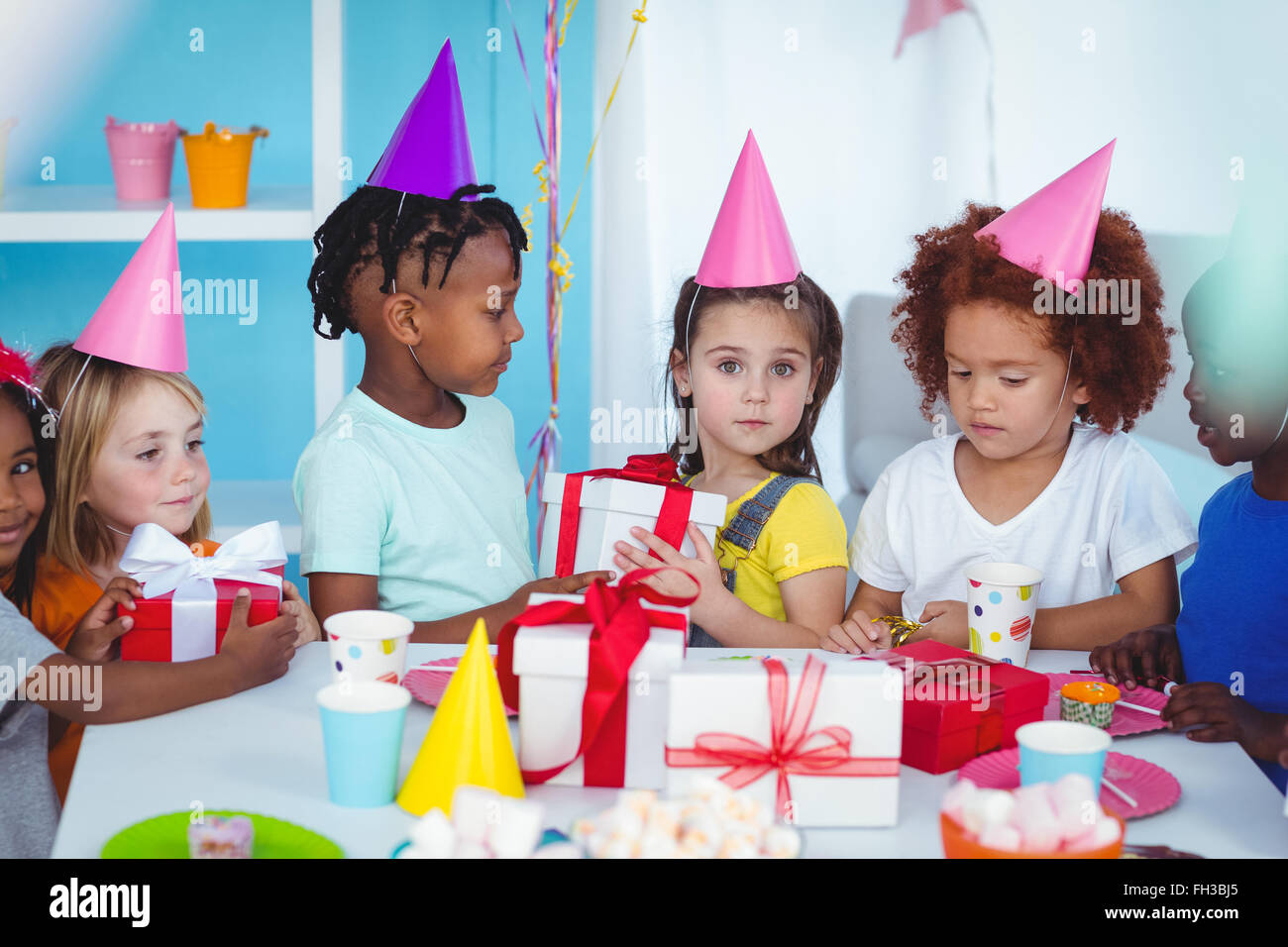 Happy kids at a birthday party Stock Photo - Alamy