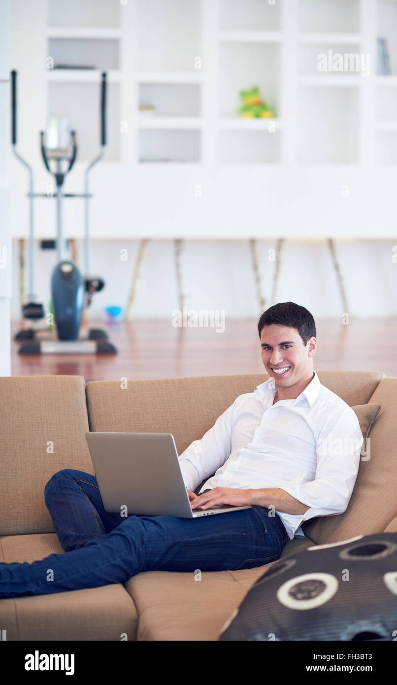 working on laptop computer from home Stock Photo - Alamy