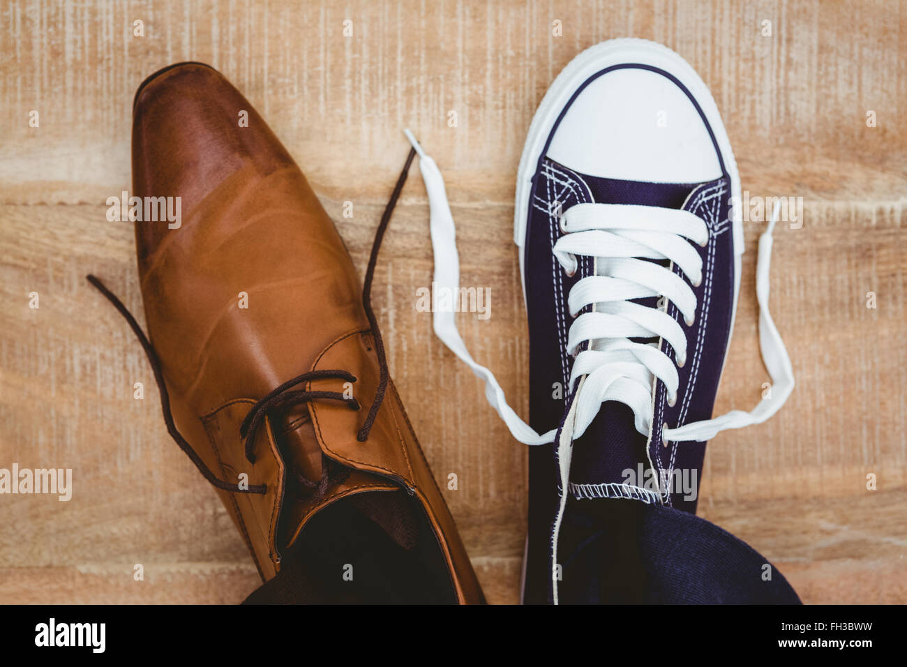 View of two different shoes Stock Photo - Alamy
