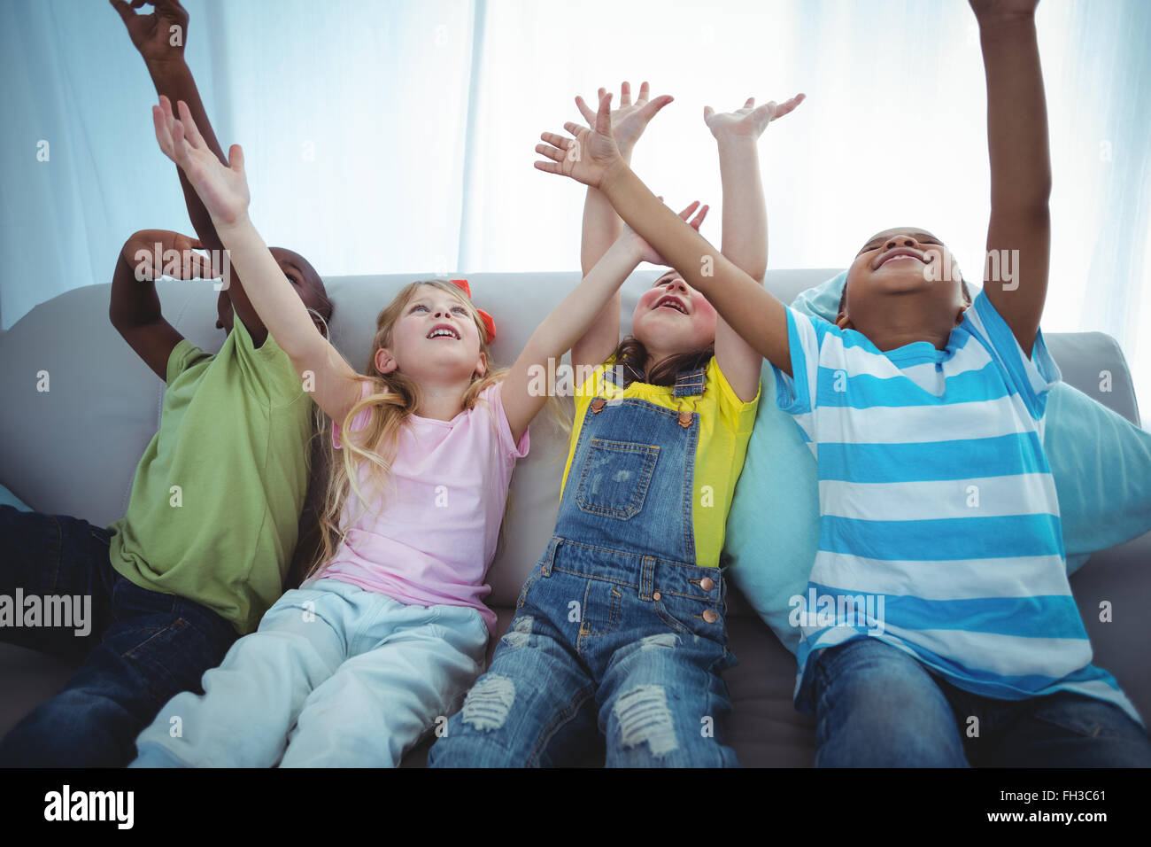 Smiling kids playing together Stock Photo - Alamy