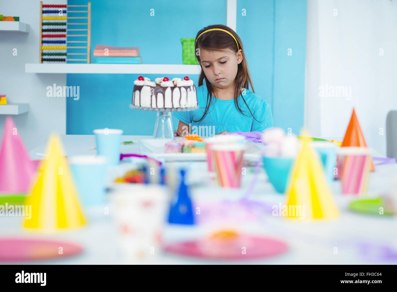 Sad kid alone at her birthday Stock Photo - Alamy