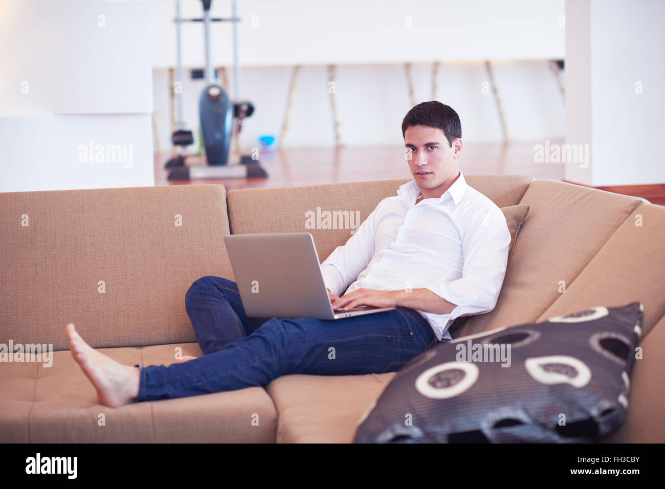 working on laptop computer from home Stock Photo - Alamy