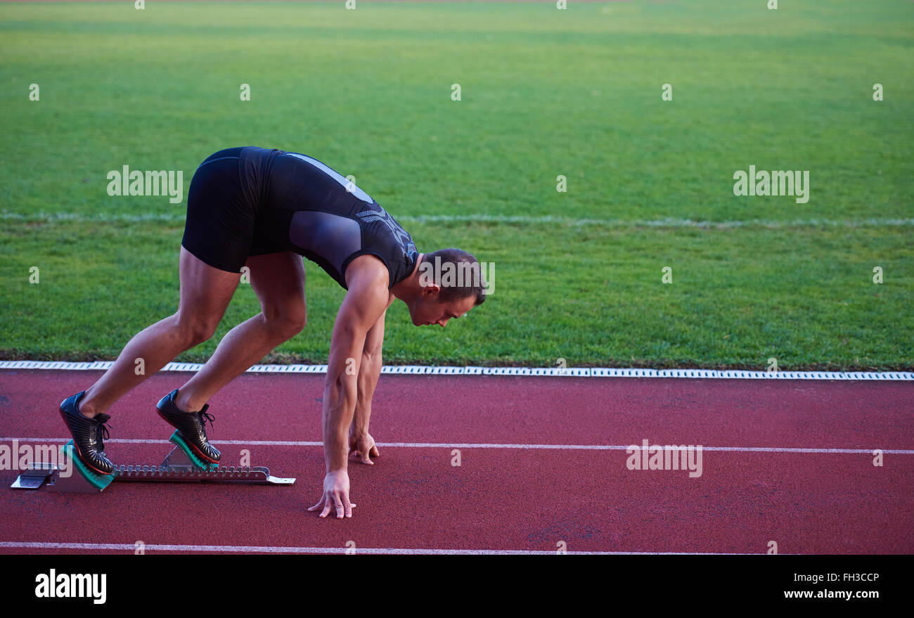 Athletic man start Stock Photo - Alamy