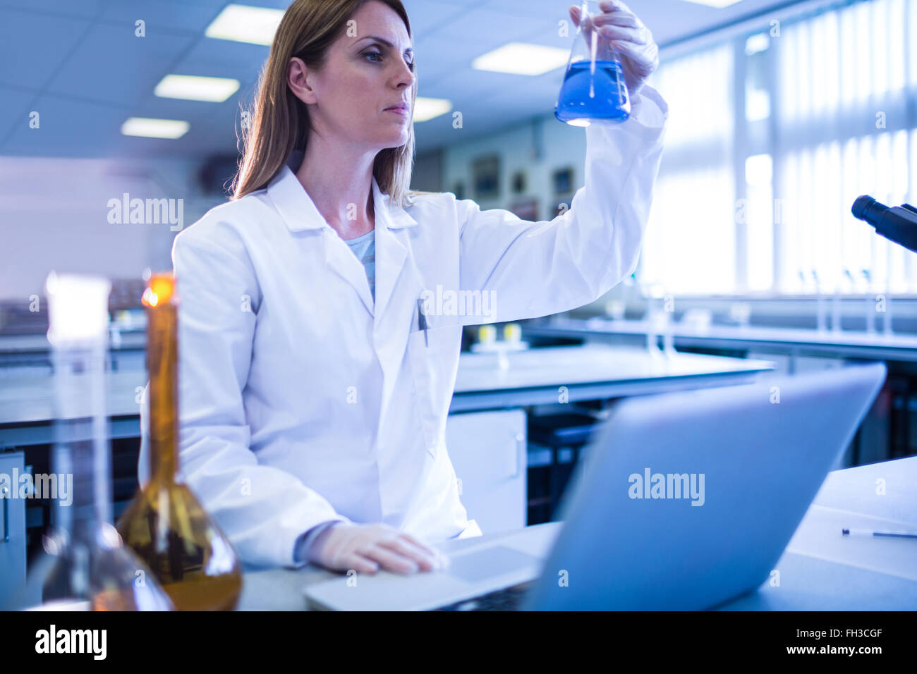 Scientist working with a laptop in laboratory Stock Photo - Alamy