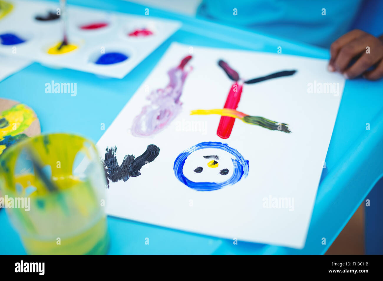 Happy kid enjoying arts and crafts painting Stock Photo - Alamy