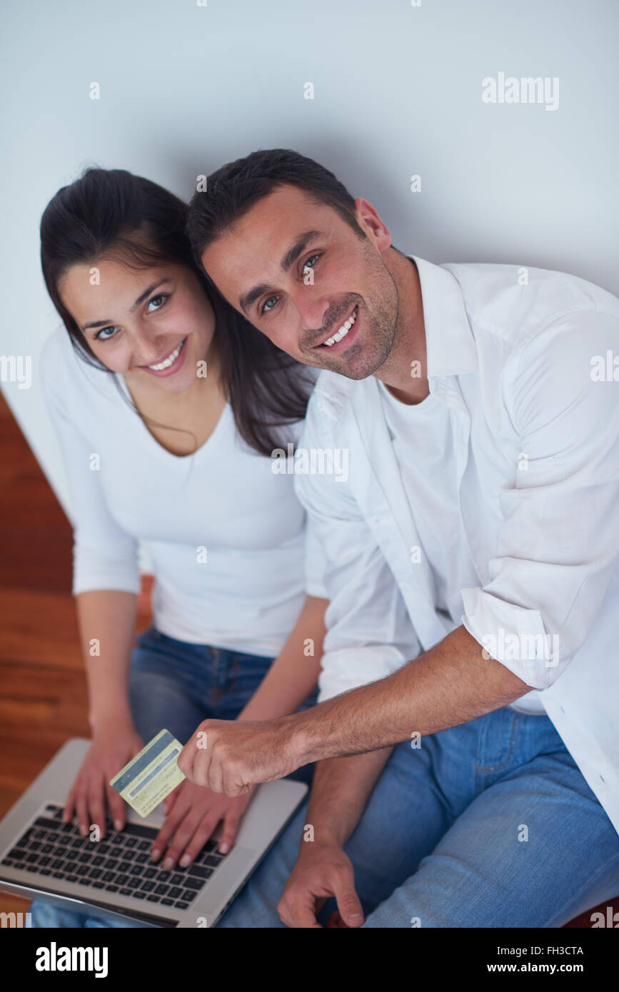 relaxed young couple working on laptop computer at home Stock Photo - Alamy