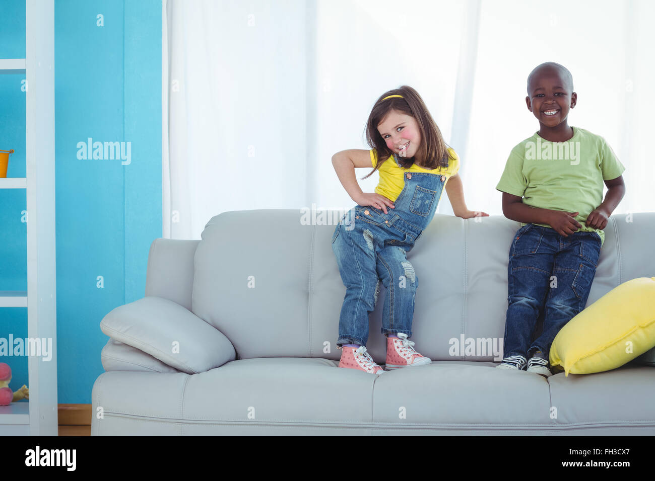 Happy boy and girl standing up Stock Photo - Alamy